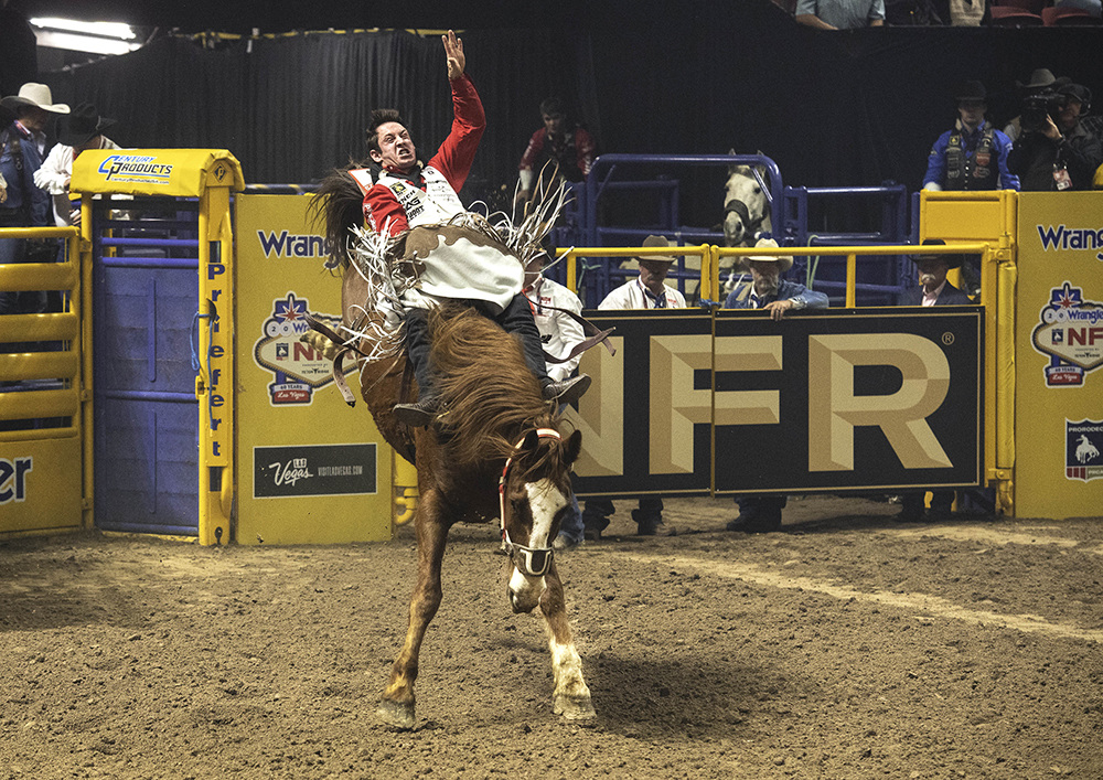 Cole Franks grimaces as he battles Rosser Rodeo’s Right On Q for 83.75 ...